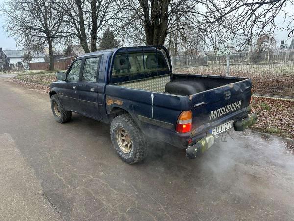 Blue Mitsubishi l-200 1998 in Taurage, with an engine capacity of 2.48 L and mileage of 288 thousand km for 2500 €, photo 5 on AUTOMOTO.COM.LV