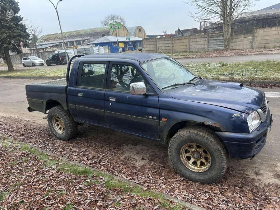 Zils Mitsubishi l-200 1998 Tauragė, ar dzinēja tilpumu 2.48 L un nobraukumu 288 tūkst. km par 2500 €, foto 8 vietnē AUTOMOTO.COM.LV