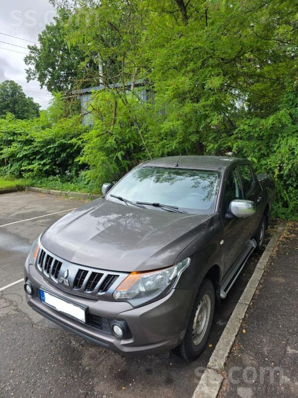 Brown Mitsubishi l-200 2018 in Riga, with an engine capacity of 2.40 L and mileage of 317 thousand km for 9400 €, photo 1 on AUTOMOTO.COM.LV
