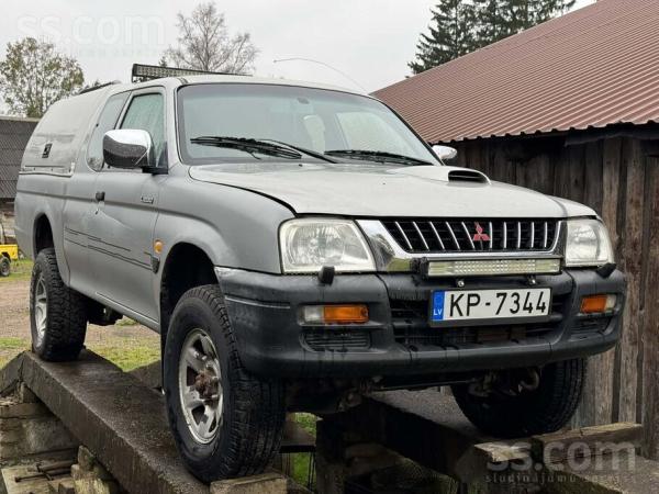 Grey Mitsubishi l-200 2001 in Liepaja, with an engine capacity of 2.50 L and mileage of 270 thousand km for 2500 €, photo 2 on AUTOMOTO.COM.LV