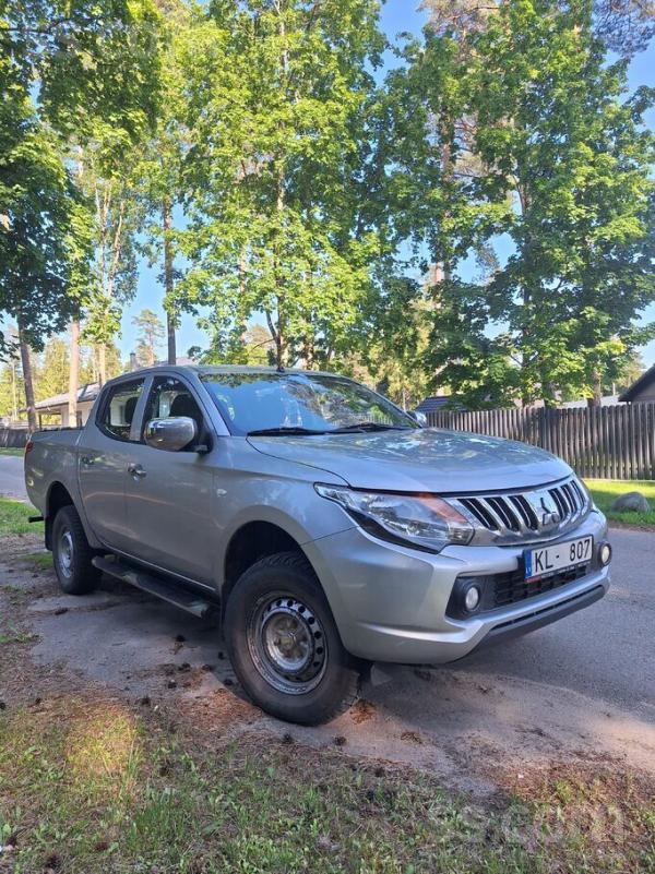 Grey Mitsubishi l-200 2016 in Ogre, with an engine capacity of 2.40 L and mileage of 333 thousand km for 10000 €, photo 2 on AUTOMOTO.COM.LV