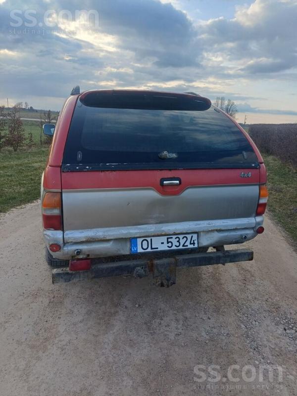 Sarkans Mitsubishi l-200 1998 Tukums, ar dzinēja tilpumu 2.50 L un nobraukumu 408 tūkst. km par 1600 €, foto 5 vietnē AUTOMOTO.COM.LV