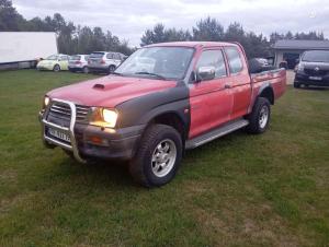 Sarkans Mitsubishi l-200 1997 Jonava, ar dzinēja tilpumu 2.48 L un nobraukumu 240 tūkst. km par 2750 €, foto  vietnē AUTOMOTO.COM.LV