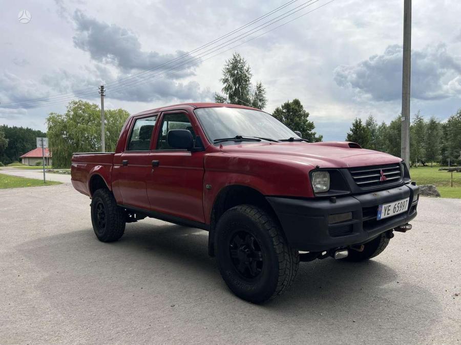 Red Mitsubishi l-200 1998 in Pasvalys, with an engine capacity of 2.50 L and mileage of 300 thousand km for 3650 €, photo 4 on AUTOMOTO.COM.LV