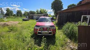 Red Mitsubishi l-200 2009 in Aizkraukle, with an engine capacity of 2.50 L and mileage of 460 thousand km for 6500 €, photo 3 on AUTOMOTO.COM.LV