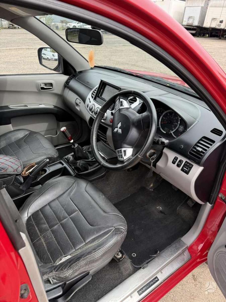 Red Mitsubishi l-200 2012 in Silute, with an engine capacity of 2.48 L and mileage of 107 thousand km for 5750 €, photo 10 on AUTOMOTO.COM.LV