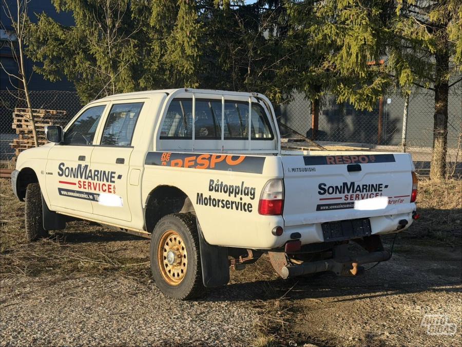 White Mitsubishi l-200 2005 in Kaunas, with an engine capacity of 2.50 L and mileage of 180 thousand km for 3900 €, photo 7 on AUTOMOTO.COM.LV