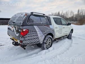 White Mitsubishi l-200 2015 in Jelgava, with an engine capacity of 2.50 L and mileage of 188 thousand km for 5950 €, photo 2 on AUTOMOTO.COM.LV