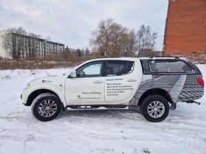 White Mitsubishi l-200 2015 in Jelgava, with an engine capacity of 2.50 L and mileage of 188 thousand km for 5950 €, photo 3 on AUTOMOTO.COM.LV