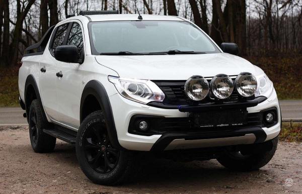White Mitsubishi l-200 2017 in Kretinga, with an engine capacity of 2.44 L and mileage of 201 thousand km for 13999 €, photo 5 on AUTOMOTO.COM.LV