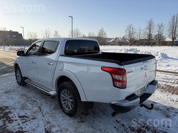 White Mitsubishi l-200 2018 in Jelgava, with an engine capacity of 2.40 L and mileage of 439 thousand km for 15500 €, photo 4 on AUTOMOTO.COM.LV