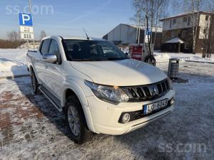 White Mitsubishi l-200 2018 in Jelgava, with an engine capacity of 2.40 L and mileage of 439 thousand km for 15500 €, photo 8 on AUTOMOTO.COM.LV