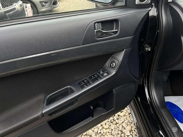 Black Mitsubishi Lancer 2008 in Kretinga, with an engine capacity of 1.97 L and mileage of 250 thousand km for 3350 €, photo 11 on AUTOMOTO.COM.LV