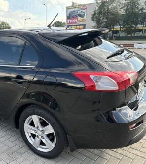 Black Mitsubishi Lancer 2009 in Riga, with an engine capacity of 1.80 L and mileage of 96 thousand km for 5200 €, photo 11 on AUTOMOTO.COM.LV