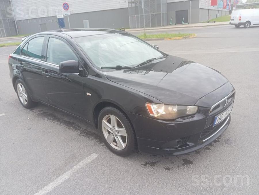 Black Mitsubishi Lancer 2009 in Riga, with an engine capacity of 1.80 L and mileage of 231 thousand km for 1000 €, photo 5 on AUTOMOTO.COM.LV