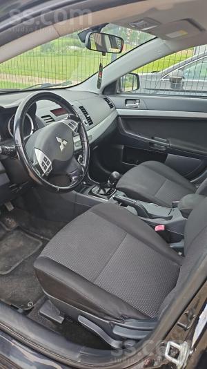 Black Mitsubishi Lancer 2009 in Aizkraukle, with an engine capacity of 2.00 L and mileage of 300 thousand km for 2300 €, photo 13 on AUTOMOTO.COM.LV