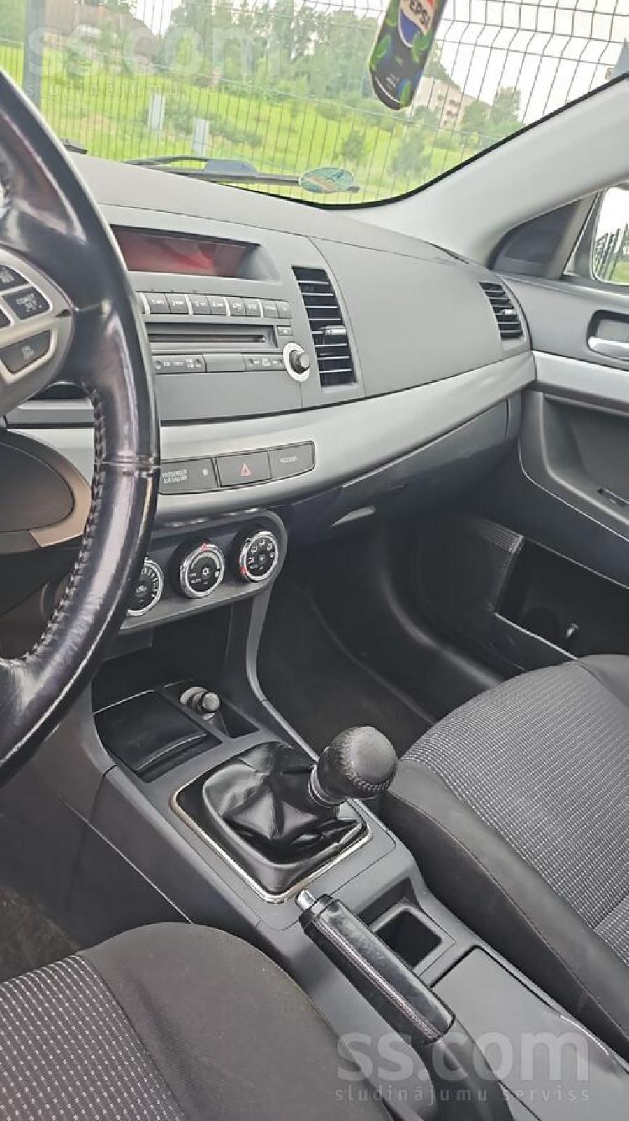 Black Mitsubishi Lancer 2009 in Aizkraukle, with an engine capacity of 2.00 L and mileage of 300 thousand km for 2300 €, photo 14 on AUTOMOTO.COM.LV