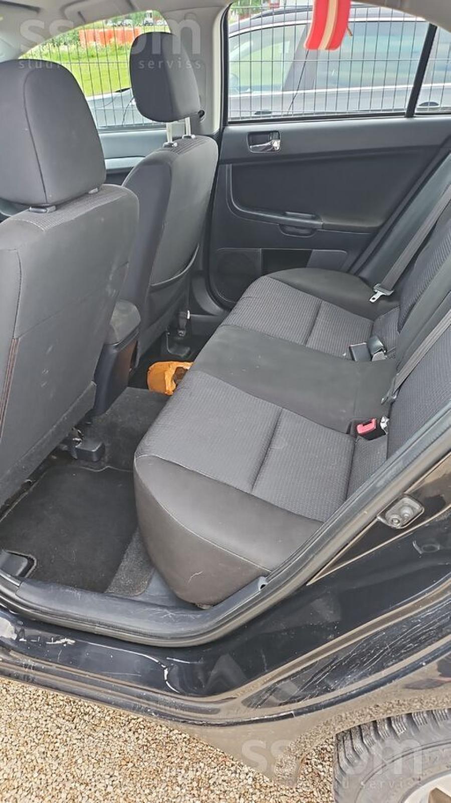 Black Mitsubishi Lancer 2009 in Aizkraukle, with an engine capacity of 2.00 L and mileage of 300 thousand km for 2300 €, photo 15 on AUTOMOTO.COM.LV