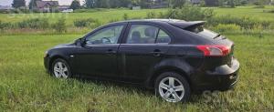 Black Mitsubishi Lancer 2009 in Aizkraukle, with an engine capacity of 2.00 L and mileage of 300 thousand km for 1700 €, photo  on AUTOMOTO.COM.LV