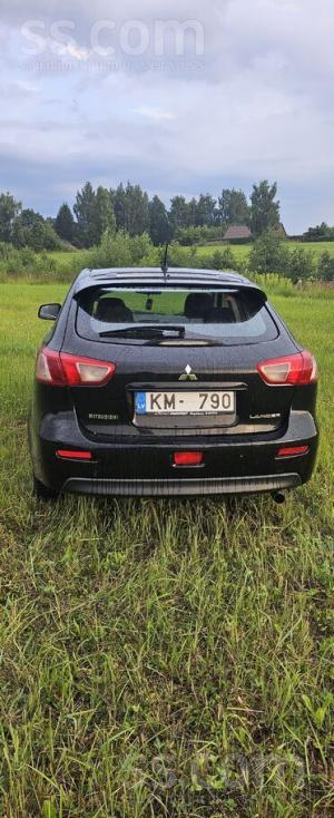 Black Mitsubishi Lancer 2009 in Aizkraukle, with an engine capacity of 2.00 L and mileage of 300 thousand km for 1700 €, photo 3 on AUTOMOTO.COM.LV