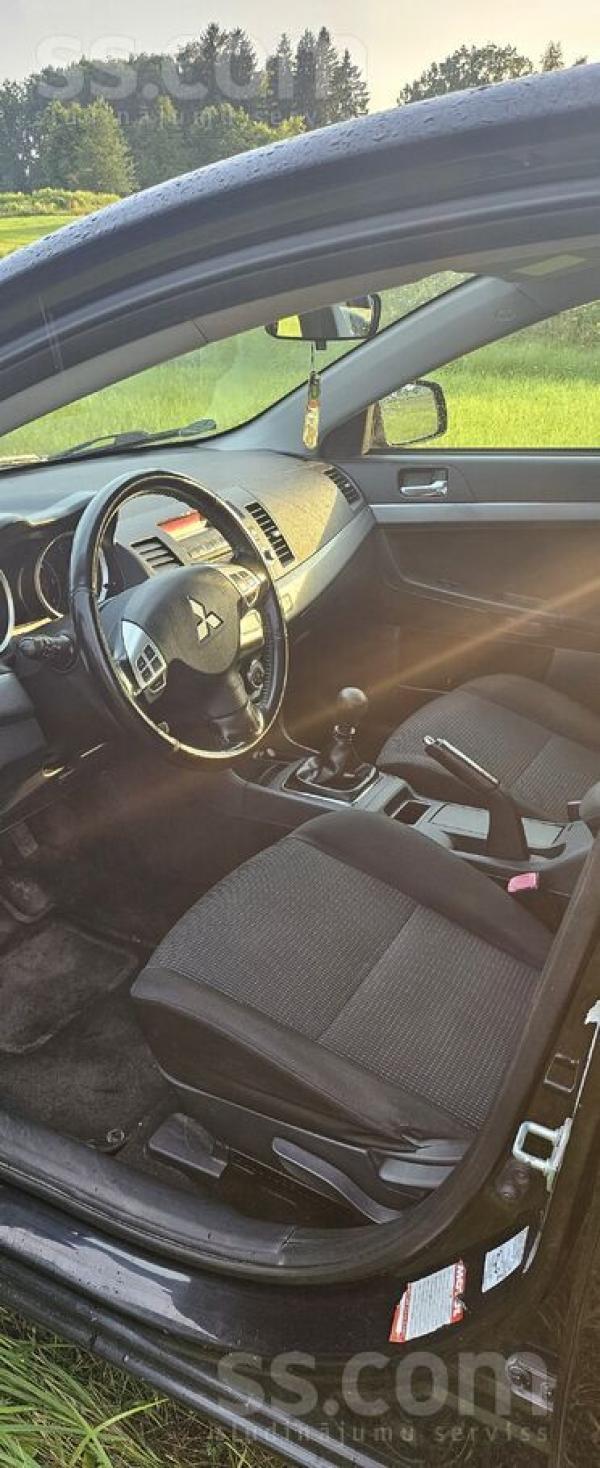 Melns Mitsubishi Lancer 2009 Aizkraukle, ar dzinēja tilpumu 2.00 L un nobraukumu 300 tūkst. km par 1700 €, foto 8 vietnē AUTOMOTO.COM.LV