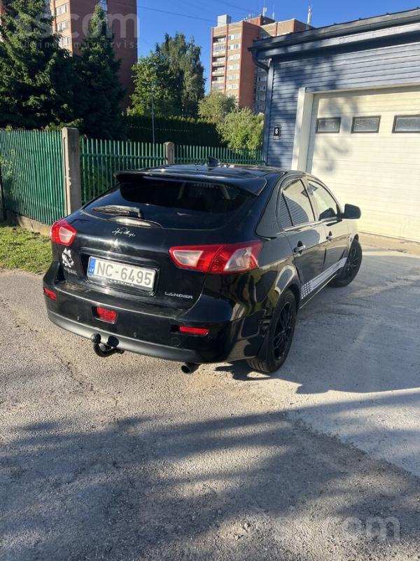 Melns Mitsubishi Lancer 2011 Rīga, ar dzinēja tilpumu 1.80 L un nobraukumu 205 tūkst. km par 3850 €, foto 4 vietnē AUTOMOTO.COM.LV