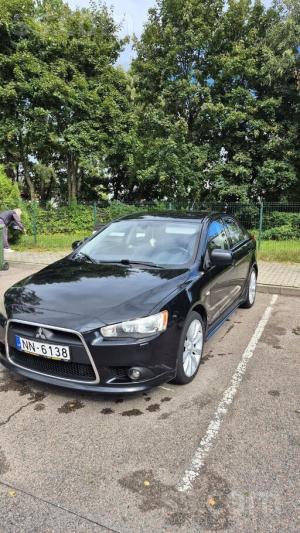 Black Mitsubishi Lancer 2011 in Riga, with an engine capacity of 2.00 L and mileage of 244 thousand km for 4200 €, photo  on AUTOMOTO.COM.LV