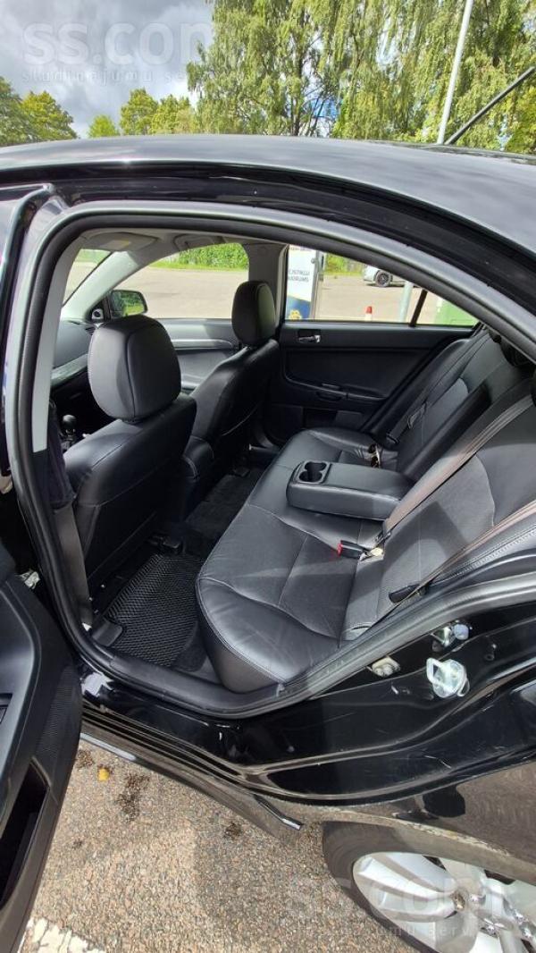 Melns Mitsubishi Lancer 2011 Rīga, ar dzinēja tilpumu 2.00 L un nobraukumu 244 tūkst. km par 4200 €, foto 3 vietnē AUTOMOTO.COM.LV