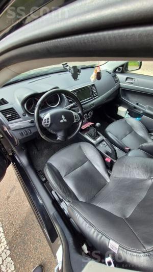 Melns Mitsubishi Lancer 2011 Rīga, ar dzinēja tilpumu 2.00 L un nobraukumu 244 tūkst. km par 4200 €, foto 4 vietnē AUTOMOTO.COM.LV
