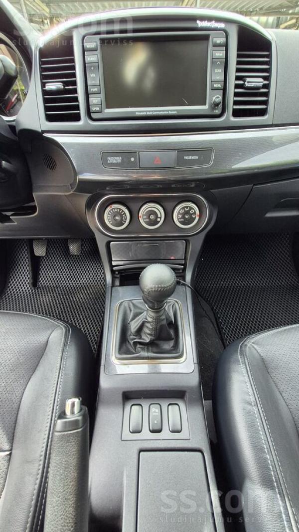 Melns Mitsubishi Lancer 2011 Rīga, ar dzinēja tilpumu 2.00 L un nobraukumu 244 tūkst. km par 4200 €, foto 5 vietnē AUTOMOTO.COM.LV