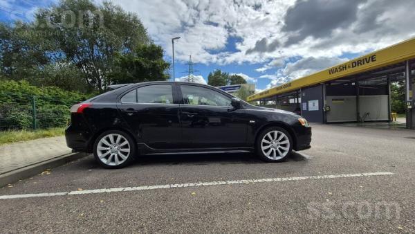 Melns Mitsubishi Lancer 2011 Rīga, ar dzinēja tilpumu 2.00 L un nobraukumu 244 tūkst. km par 4200 €, foto 7 vietnē AUTOMOTO.COM.LV