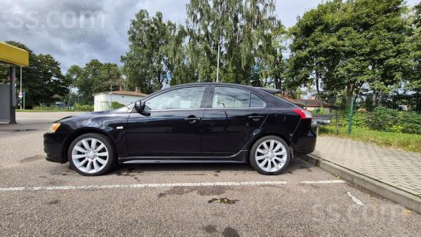 Melns Mitsubishi Lancer 2011 Rīga, ar dzinēja tilpumu 2.00 L un nobraukumu 244 tūkst. km par 4200 €, foto 9 vietnē AUTOMOTO.COM.LV