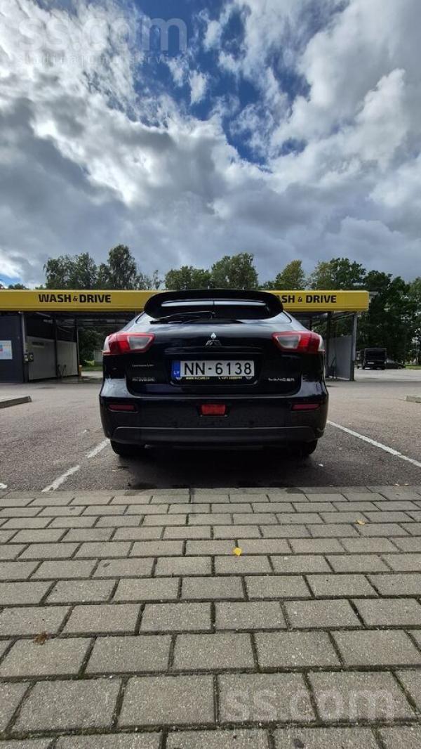 Black Mitsubishi Lancer 2011 in Riga, with an engine capacity of 2.00 L and mileage of 244 thousand km for 4200 €, photo 8 on AUTOMOTO.COM.LV