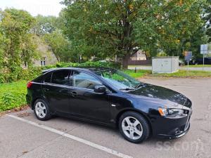 Black Mitsubishi Lancer 2011 in Riga, with an engine capacity of 1.60 L and mileage of 206 thousand km for 3350 €, photo  on AUTOMOTO.COM.LV