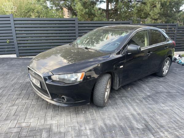 Black Mitsubishi Lancer 2012 in Vilnius, with an engine capacity of 2.00 L and mileage of 470 thousand km for 2000 €, photo 1 on AUTOMOTO.COM.LV