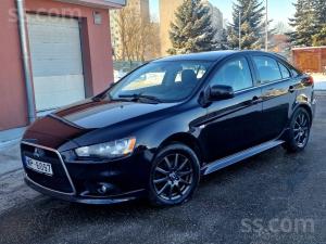 Black Mitsubishi Lancer 2013 in Jelgava, with an engine capacity of 2.00 L and mileage of 242 thousand km for 4999 €, photo 2 on AUTOMOTO.COM.LV