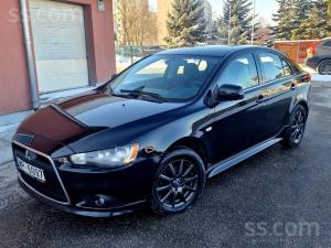 Black Mitsubishi Lancer 2013 in Jelgava, with an engine capacity of 2.00 L and mileage of 242 thousand km for 4999 €, photo 3 on AUTOMOTO.COM.LV