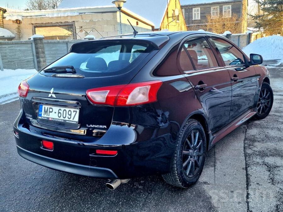 Black Mitsubishi Lancer 2013 in Jelgava, with an engine capacity of 2.00 L and mileage of 242 thousand km for 4999 €, photo 7 on AUTOMOTO.COM.LV