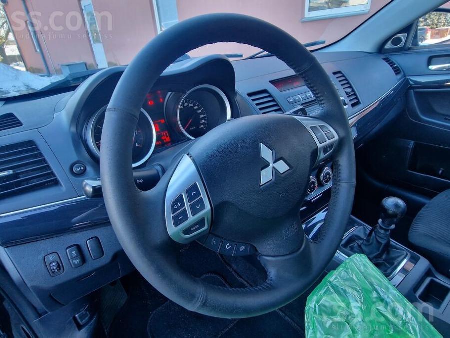Black Mitsubishi Lancer 2013 in Jelgava, with an engine capacity of 2.00 L and mileage of 242 thousand km for 4999 €, photo 17 on AUTOMOTO.COM.LV