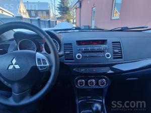 Black Mitsubishi Lancer 2013 in Jelgava, with an engine capacity of 2.00 L and mileage of 242 thousand km for 4999 €, photo 18 on AUTOMOTO.COM.LV
