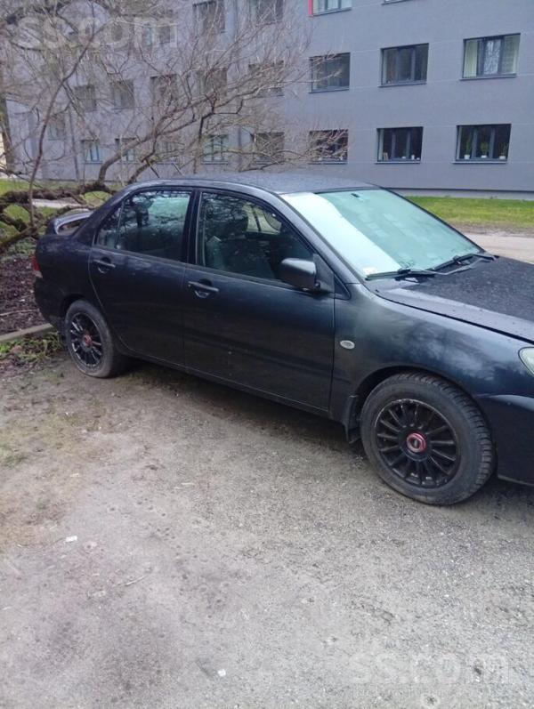 Melns Mitsubishi Lancer 2005 Jūrmala, ar dzinēja tilpumu 1.60 L un nobraukumu 186 tūkst. km par 500 €, foto 1 vietnē AUTOMOTO.COM.LV