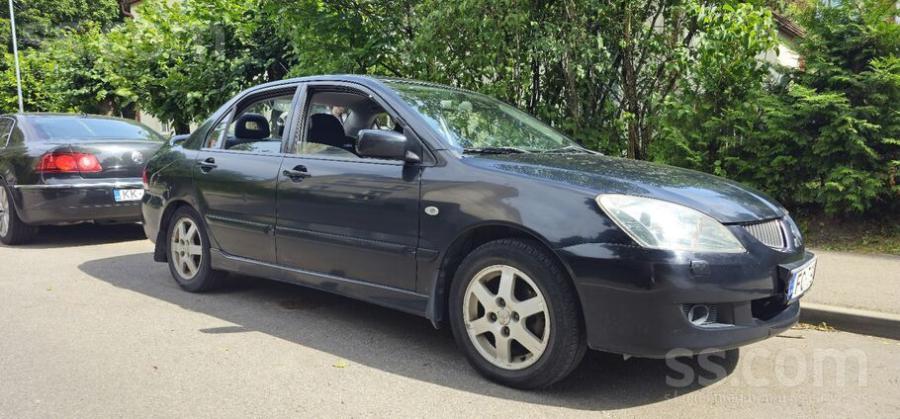 Black Mitsubishi Lancer 2005 in Riga, with an engine capacity of 1.40 L and mileage of 130 thousand km for 1200 €, photo 3 on AUTOMOTO.COM.LV