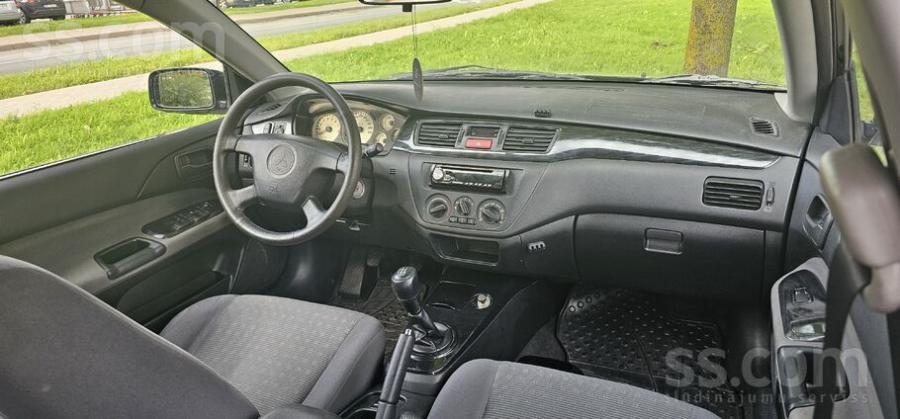 Black Mitsubishi Lancer 2005 in Riga, with an engine capacity of 1.40 L and mileage of 130 thousand km for 1200 €, photo 7 on AUTOMOTO.COM.LV