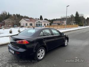 Black Mitsubishi Lancer 2008 in Tallinn, with an engine capacity of 1.80 L and mileage of 124 thousand km for 2990 €, photo 3 on AUTOMOTO.COM.LV