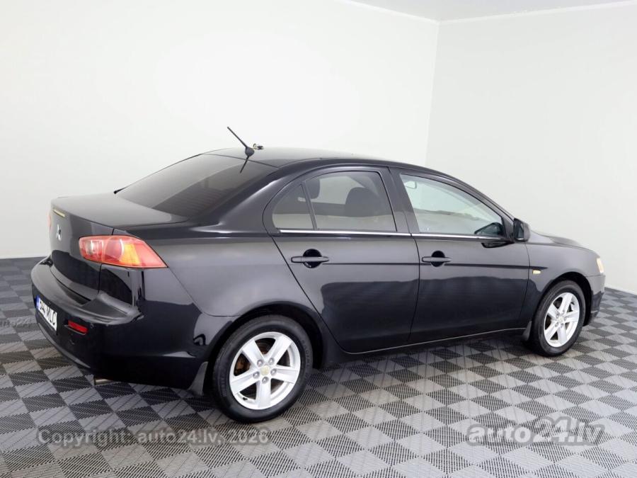 Black Mitsubishi Lancer 2008 in Tallinn, with an engine capacity of 1.50 L and mileage of 118 thousand km for 2499 €, photo 3 on AUTOMOTO.COM.LV