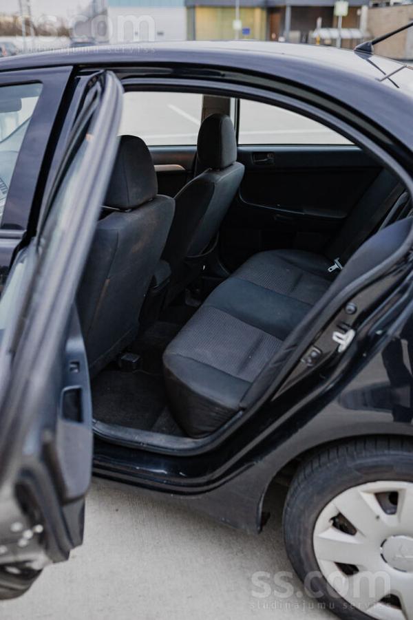 Melns Mitsubishi Lancer 2008 Rīga, ar dzinēja tilpumu 1.50 L un nobraukumu 226 tūkst. km par 1800 €, foto 8 vietnē AUTOMOTO.COM.LV