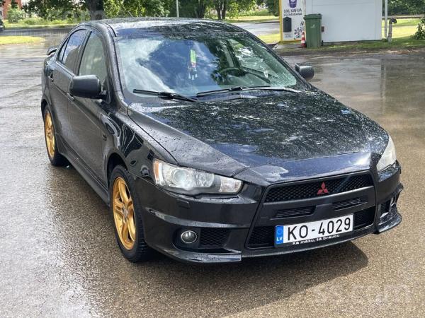 Black Mitsubishi Lancer 2008 in Cesis, with an engine capacity of 1.80 L and mileage of 250 thousand km for 3150 €, photo 1 on AUTOMOTO.COM.LV