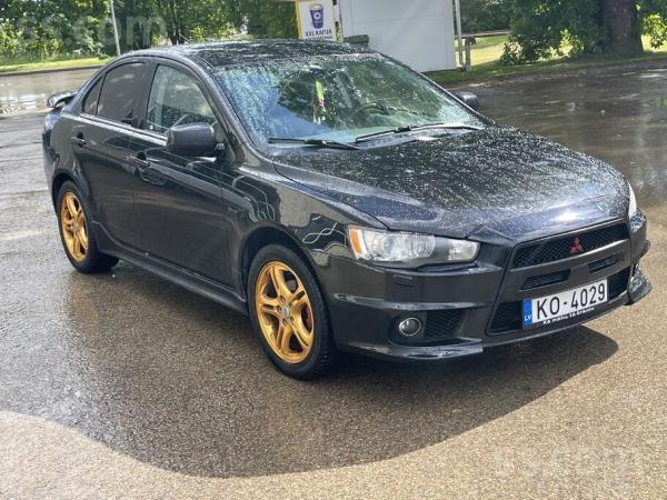 Black Mitsubishi Lancer 2008 in Cesis, with an engine capacity of 1.80 L and mileage of 250 thousand km for 3150 €, photo 2 on AUTOMOTO.COM.LV