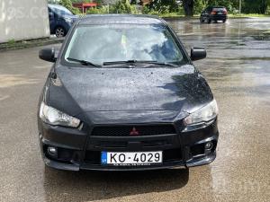 Black Mitsubishi Lancer 2008 in Cesis, with an engine capacity of 1.80 L and mileage of 250 thousand km for 3150 €, photo 4 on AUTOMOTO.COM.LV