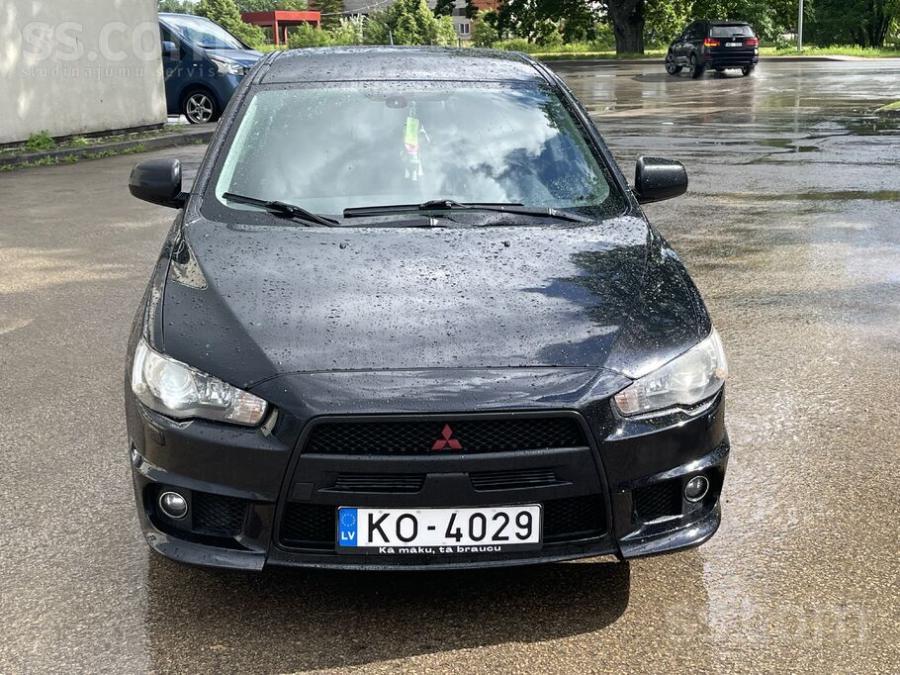 Black Mitsubishi Lancer 2008 in Cesis, with an engine capacity of 1.80 L and mileage of 250 thousand km for 3150 €, photo 4 on AUTOMOTO.COM.LV